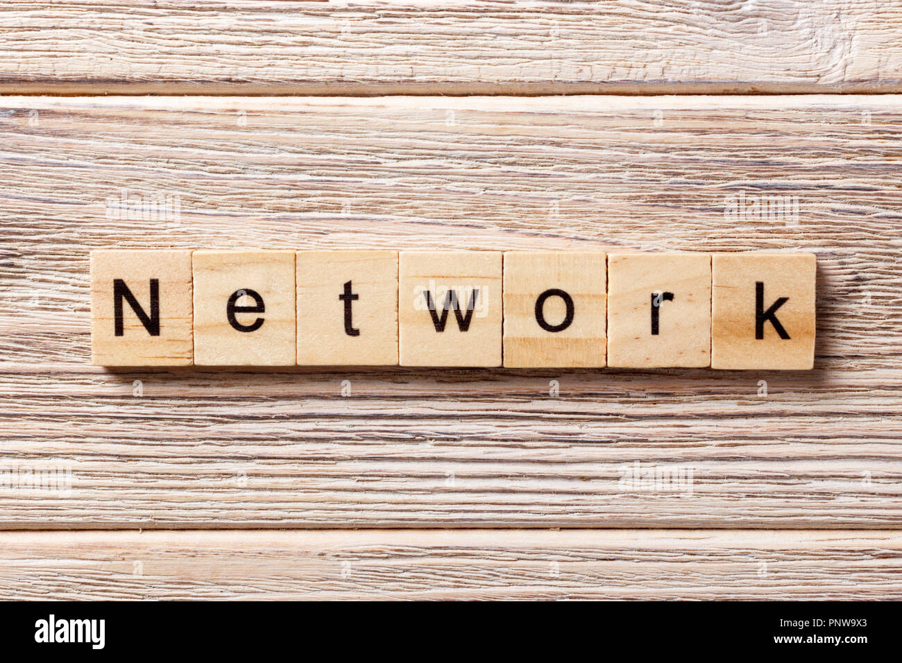 Network word written on wood block. Network text on table, concept ...