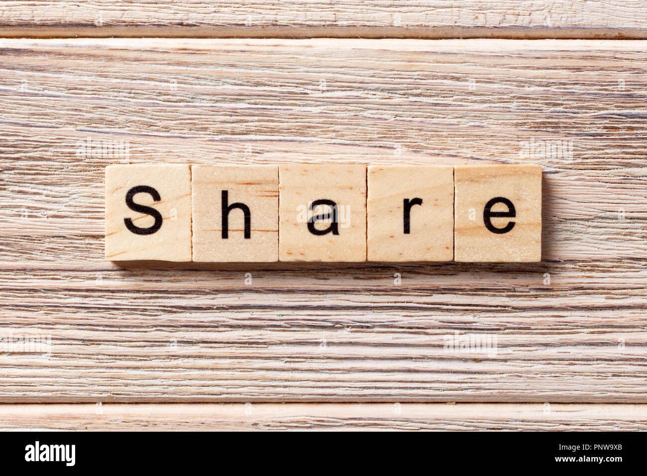 share word written on wood block. share text on table, concept Stock ...