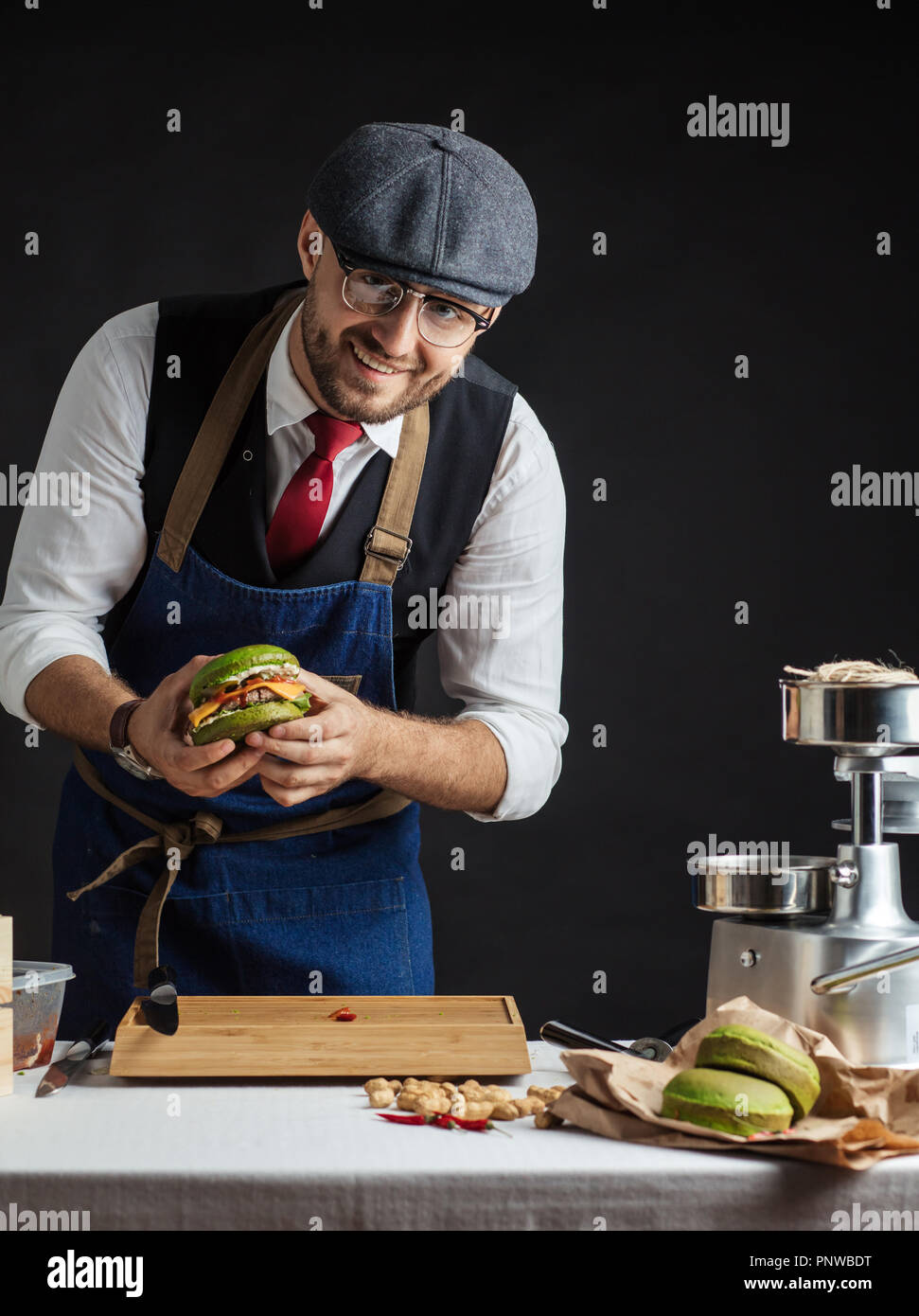 Food lover enjoys ready made self cooking of burgers and then Stock ...