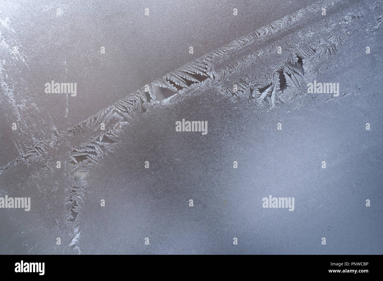 Winter frosted window with diagonal strip of frosty pattern Stock Photo ...