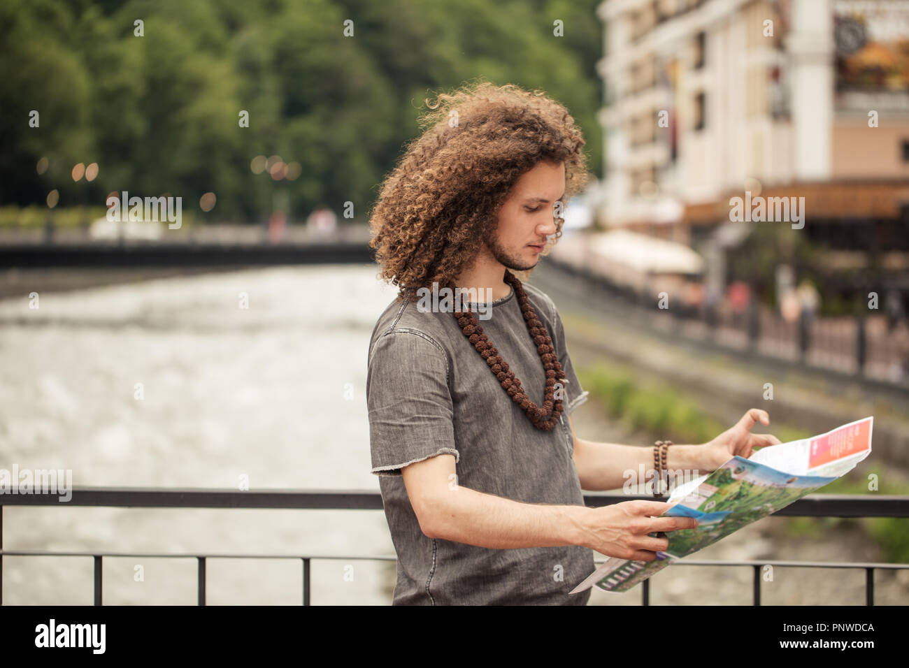 tourist with route maps looking for a way in city. search landmarks ...