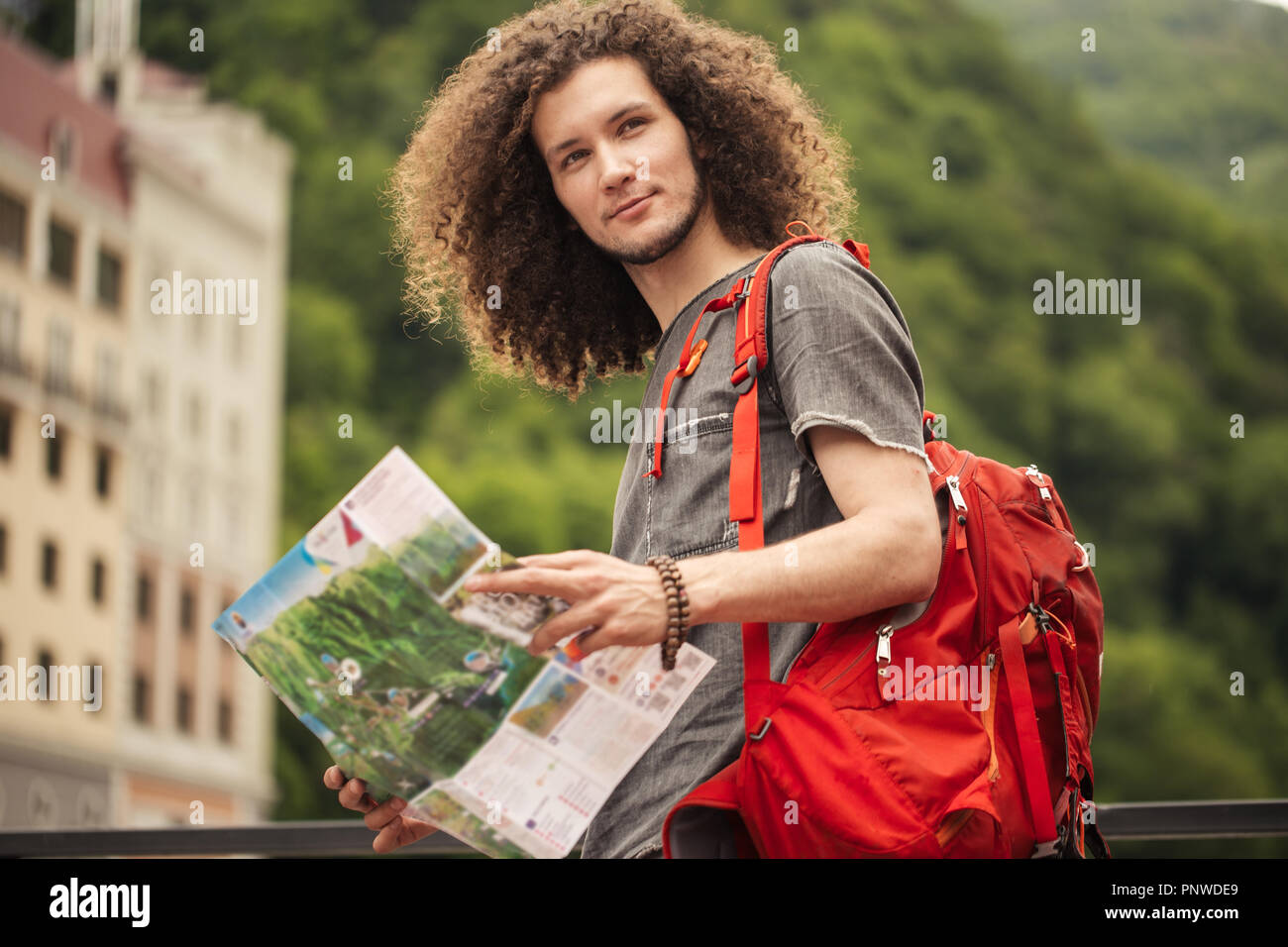 tourist with route maps looking for a way in city. search landmarks ...