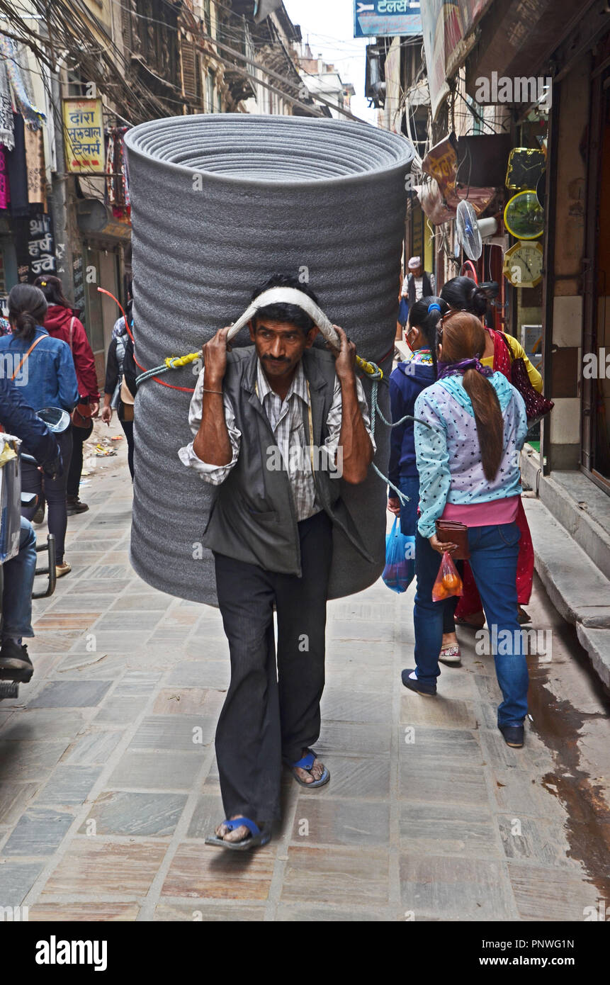Man carrying heavy load on back hi-res stock photography and images - Alamy