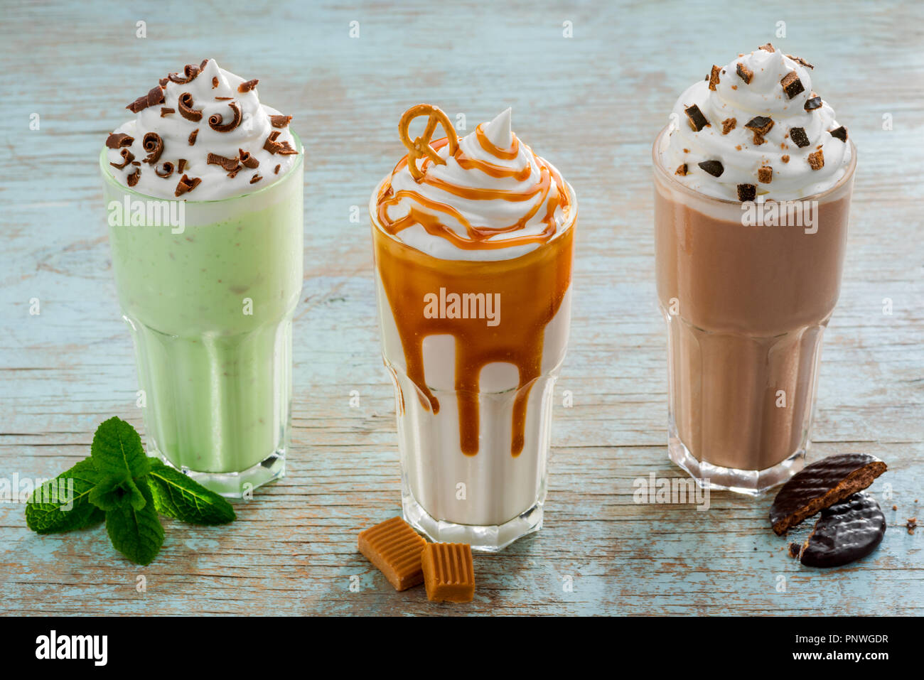 Tasty different milkshakes with ingredients Stock Photo - Alamy