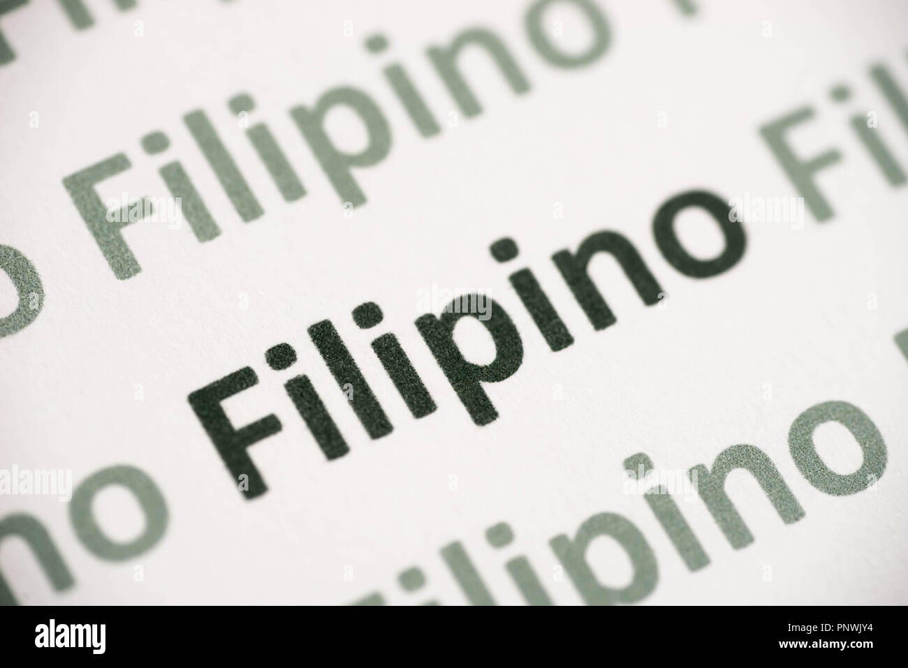 word Filipino language printed on white paper macro Stock Photo - Alamy