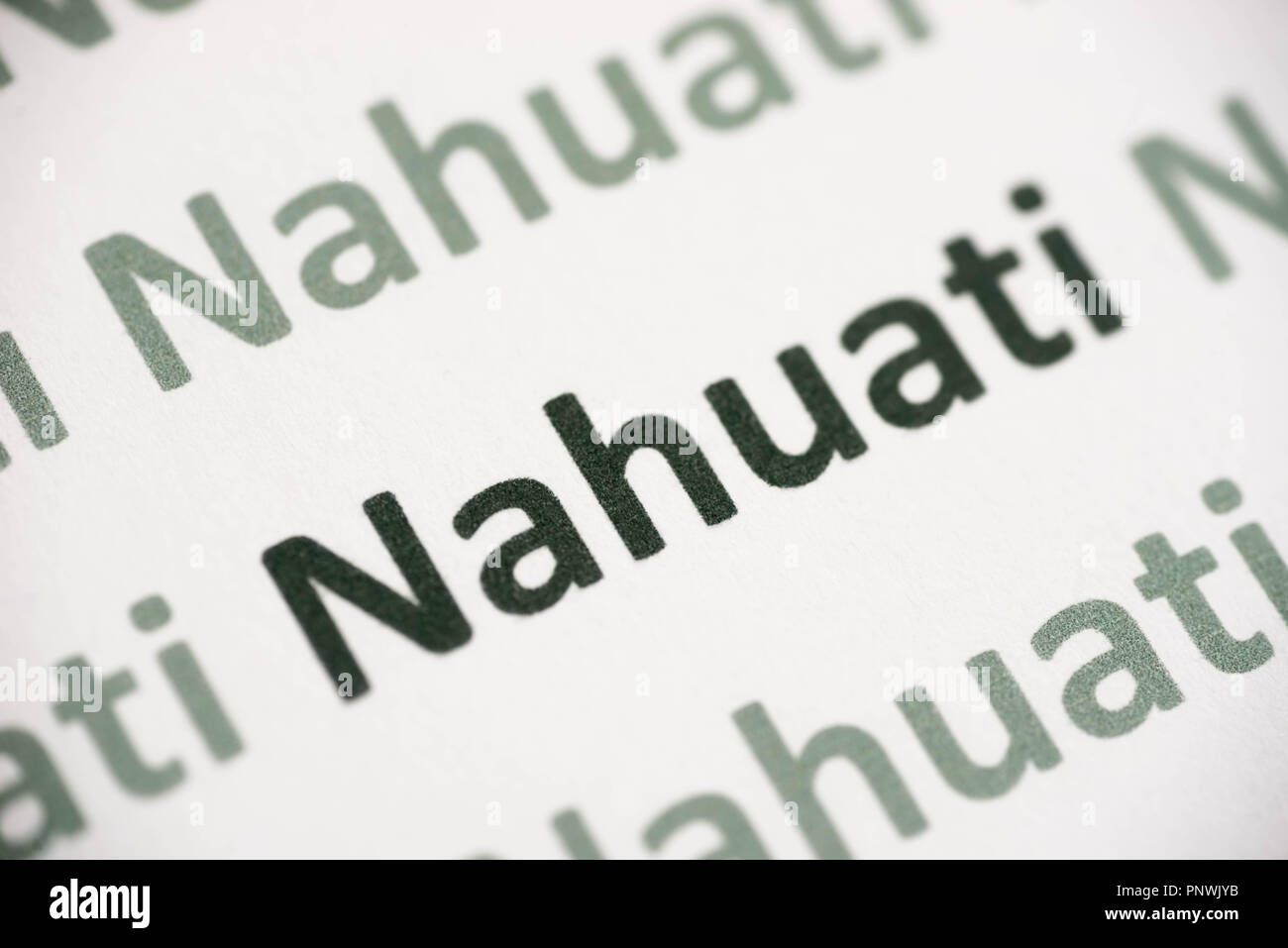 word Nahuati language printed on white paper macro Stock Photo - Alamy