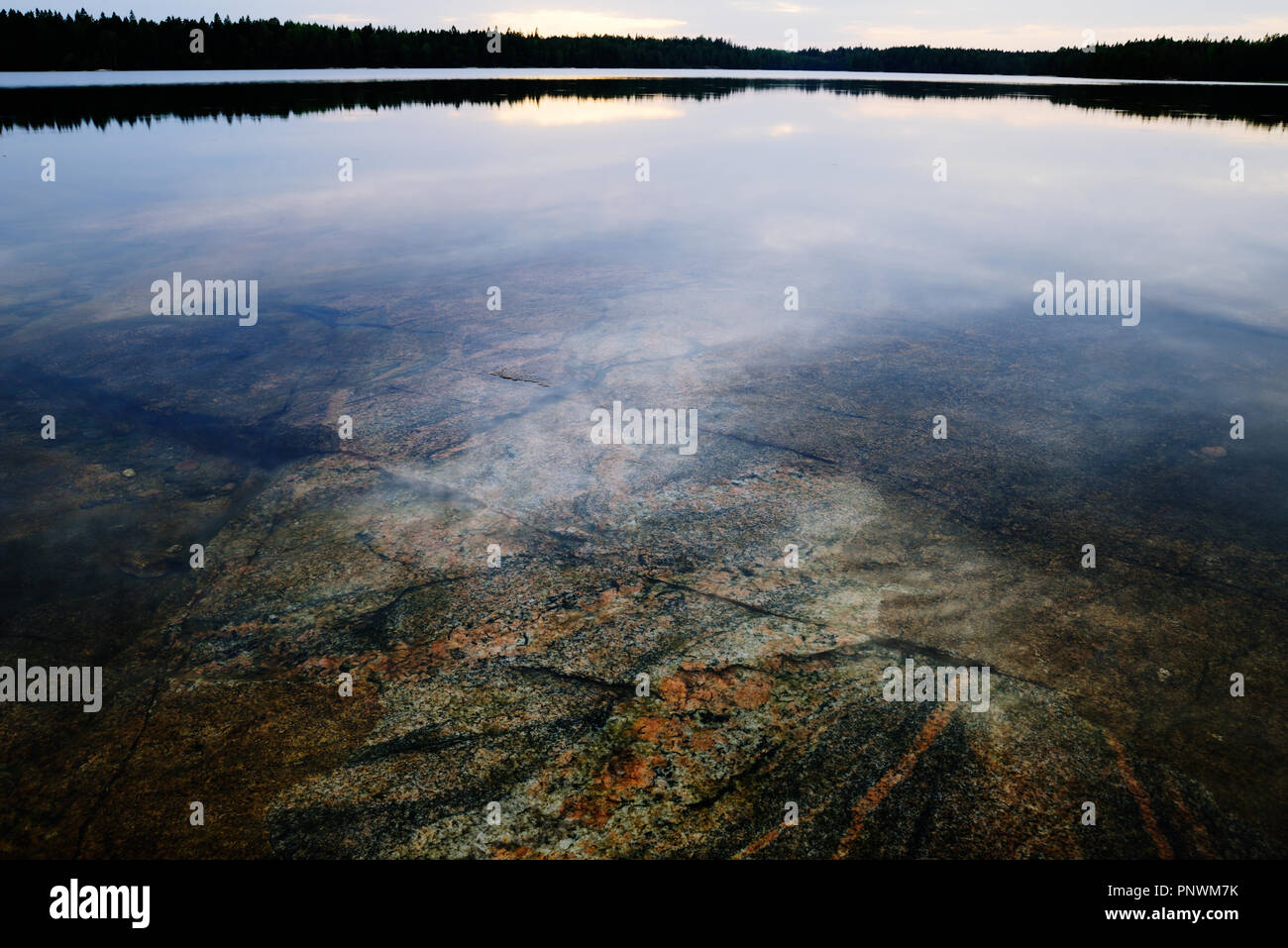 granite slab under the surface of the water, landscape Stock Photo - Alamy