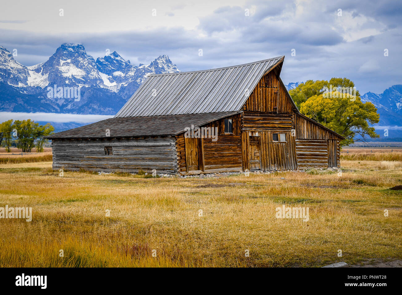 Iconic Mormon Barn with Grand Tetons in distance Stock Photo - Alamy