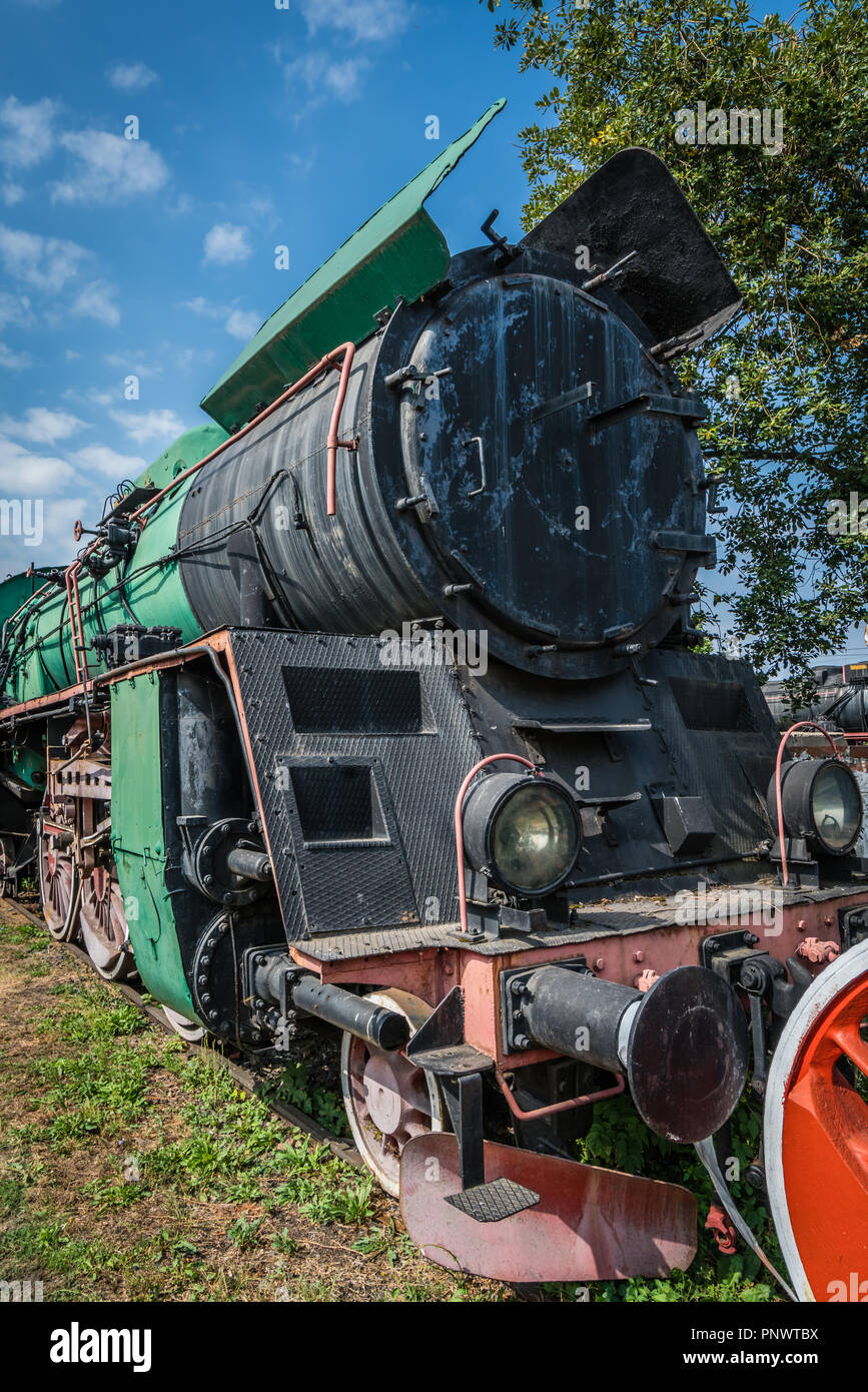 An old disused retro steam train locomotive on the side track Stock ...