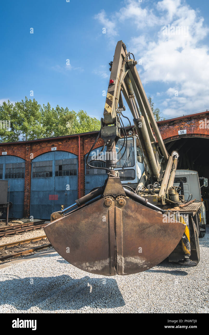 Large industrial excavator car used to unloading goods and material ...