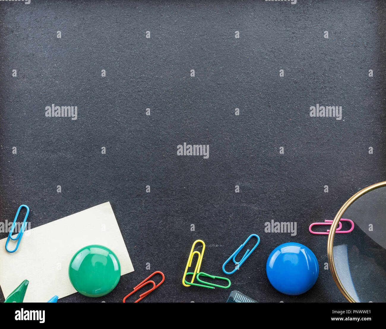 Blackboard and different school things. Close up Stock Photo - Alamy