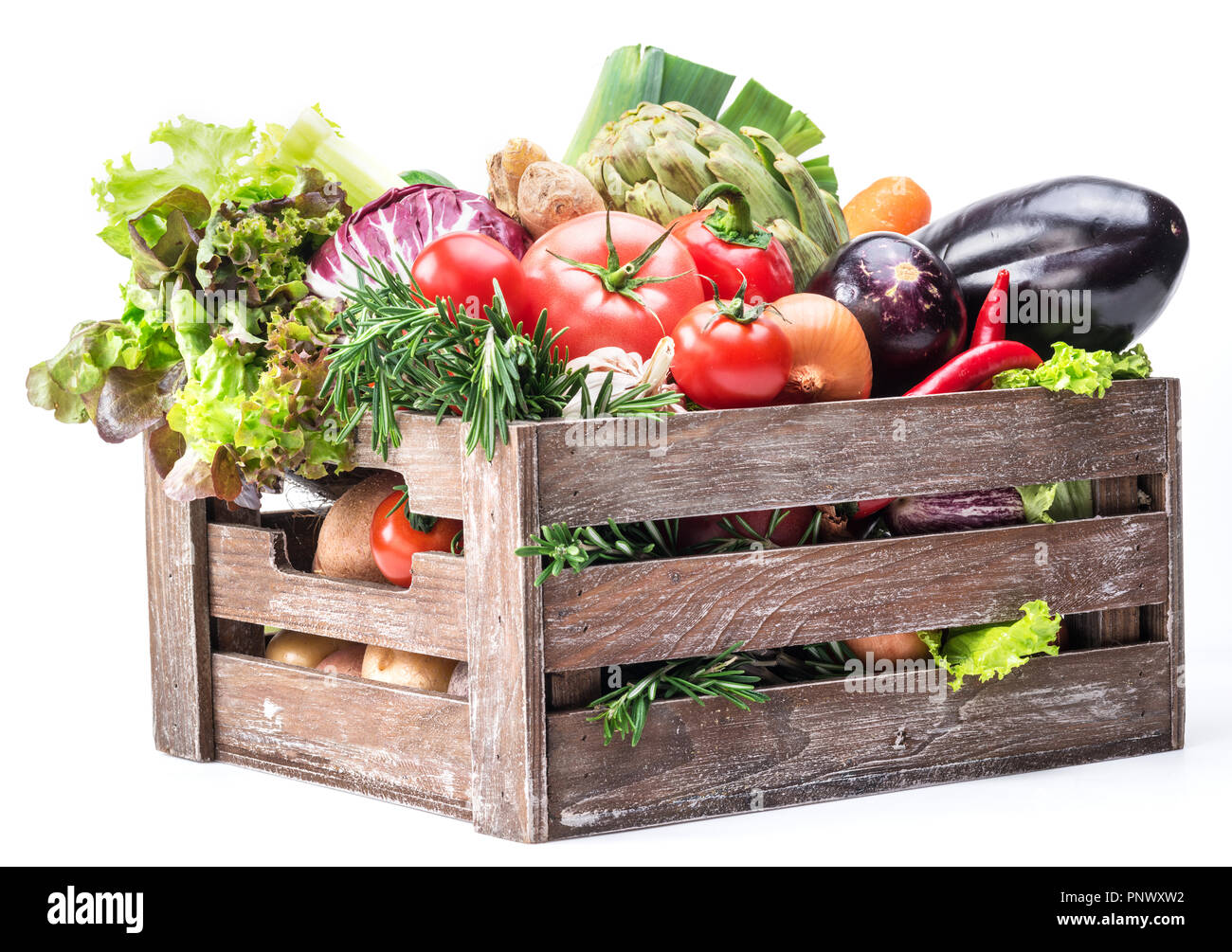 Fresh multi-colored vegetables in wooden crate.White background Stock ...