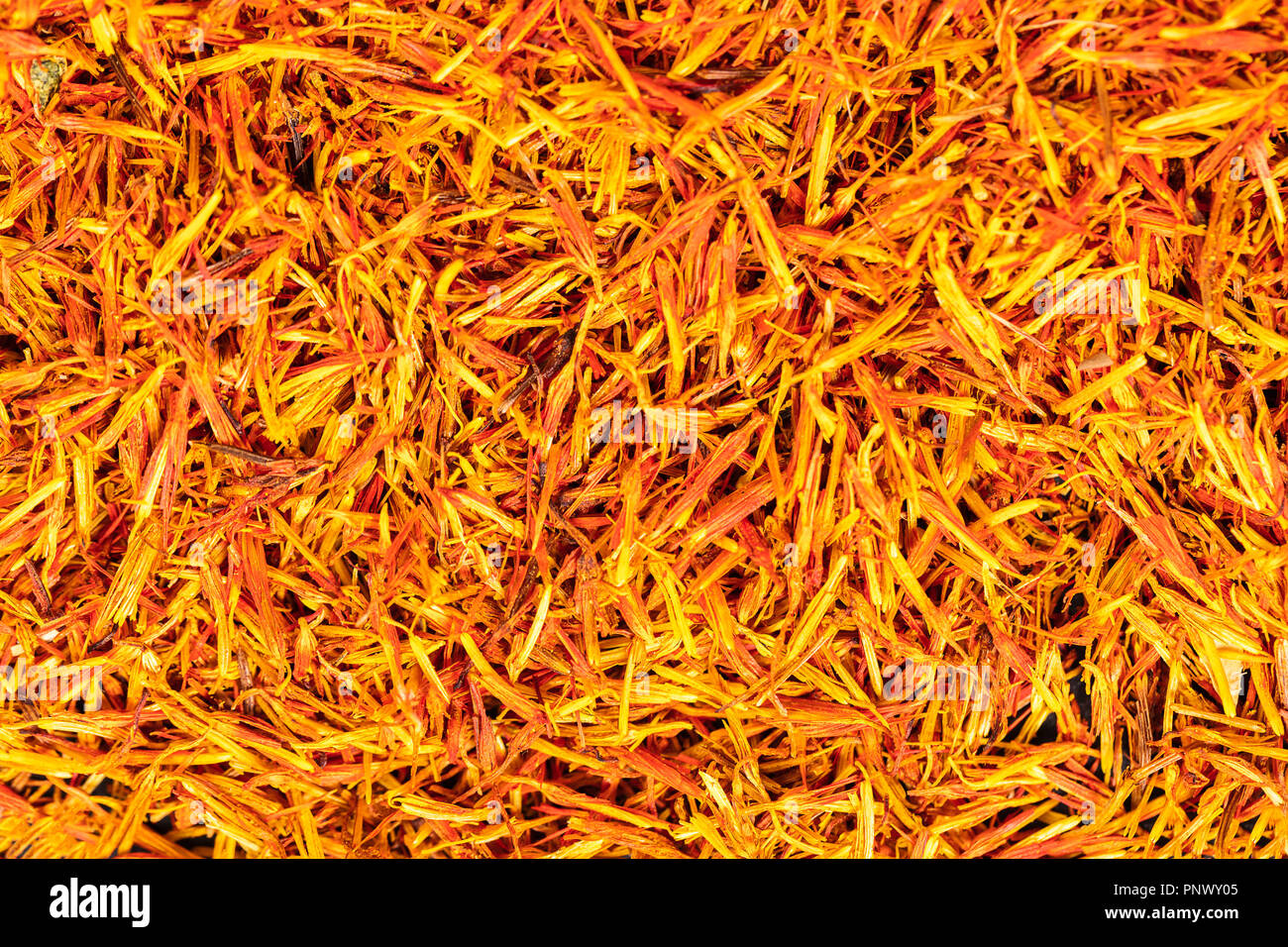 food background from the texture of dry saffron closeup Stock Photo - Alamy