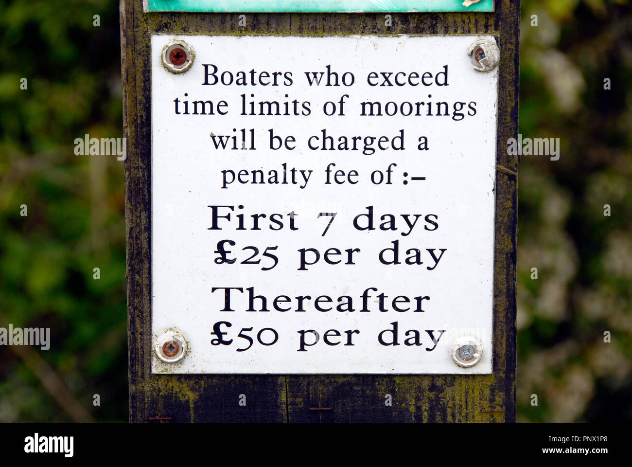 Close up of sign showing penalties for overstaying time limits for ...