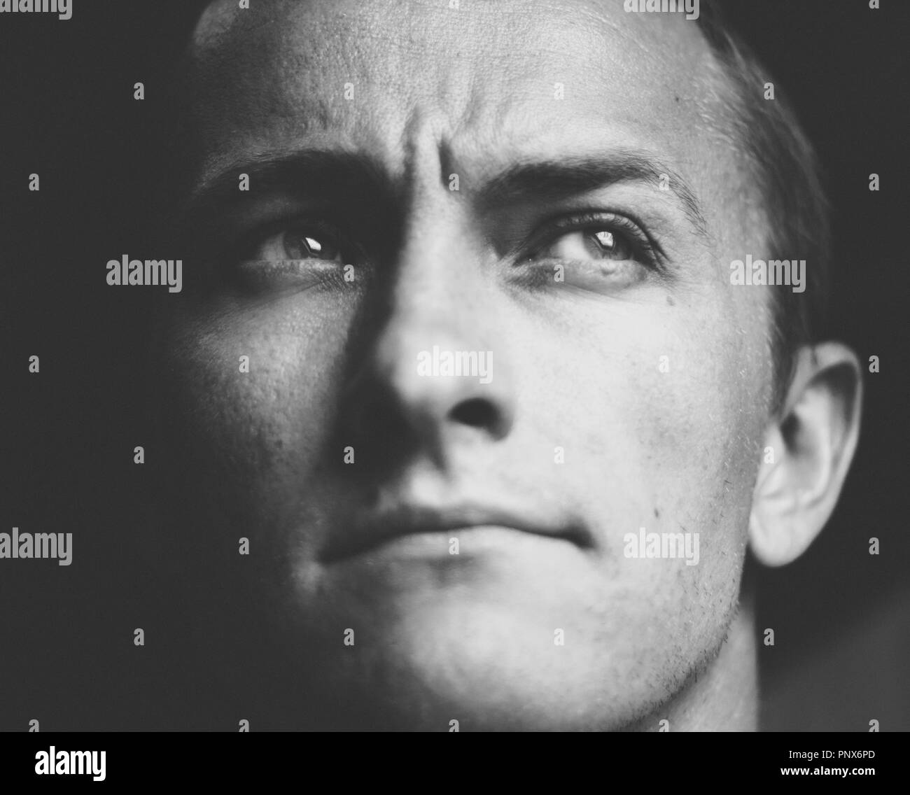 Black and white self portrait, looking off camera at a window Stock ...