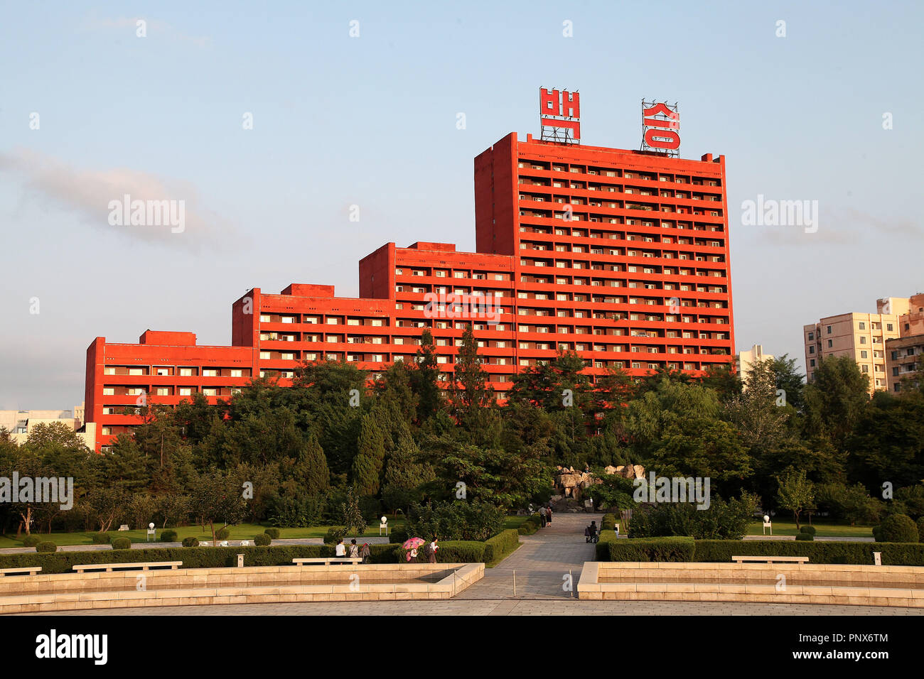 Red residential apartment building next to the Monument to Party ...