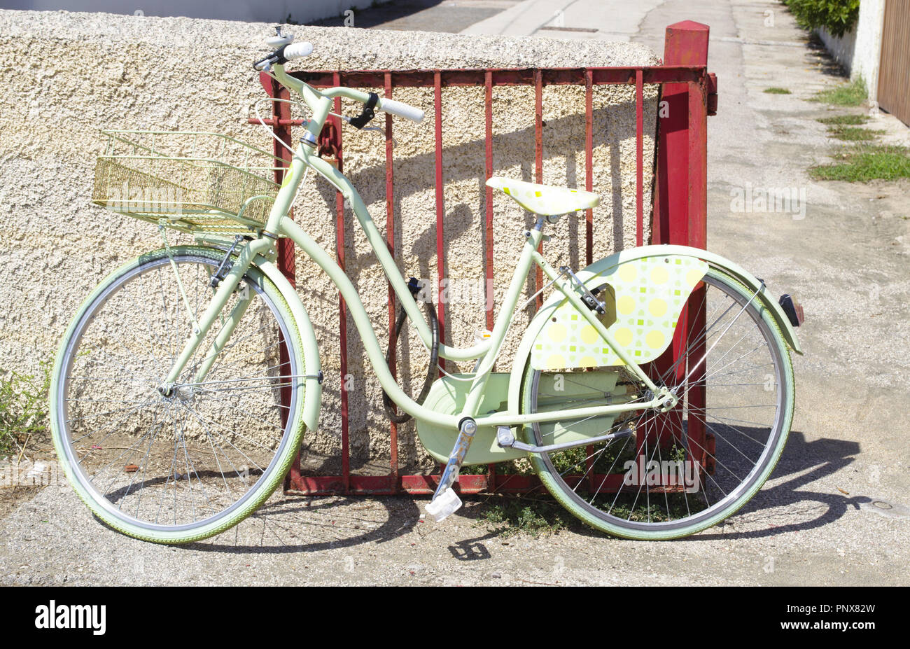 Bicycle and fence hi-res stock photography and images - Alamy