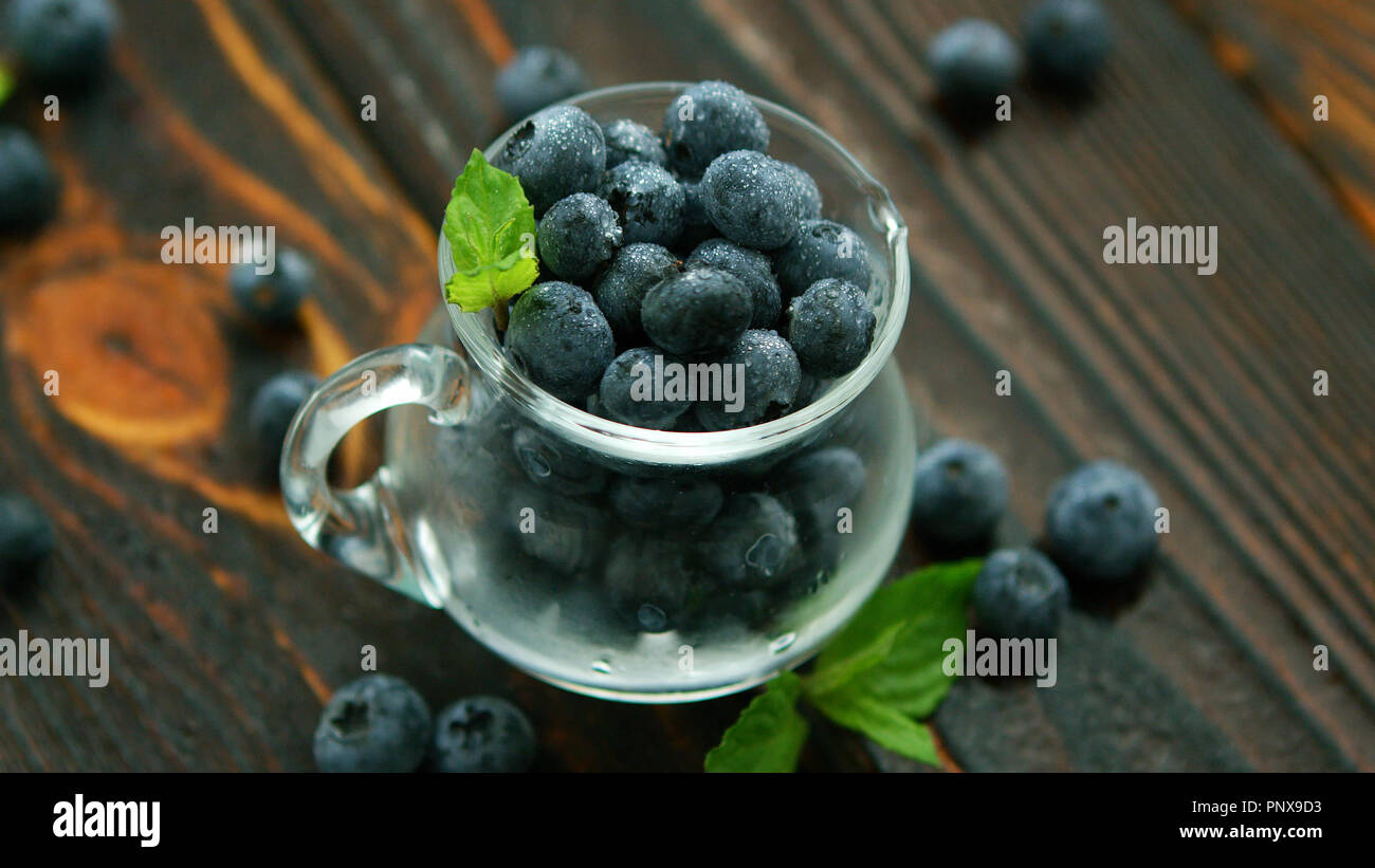 Jug full of blueberry with green leaf Stock Photo - Alamy
