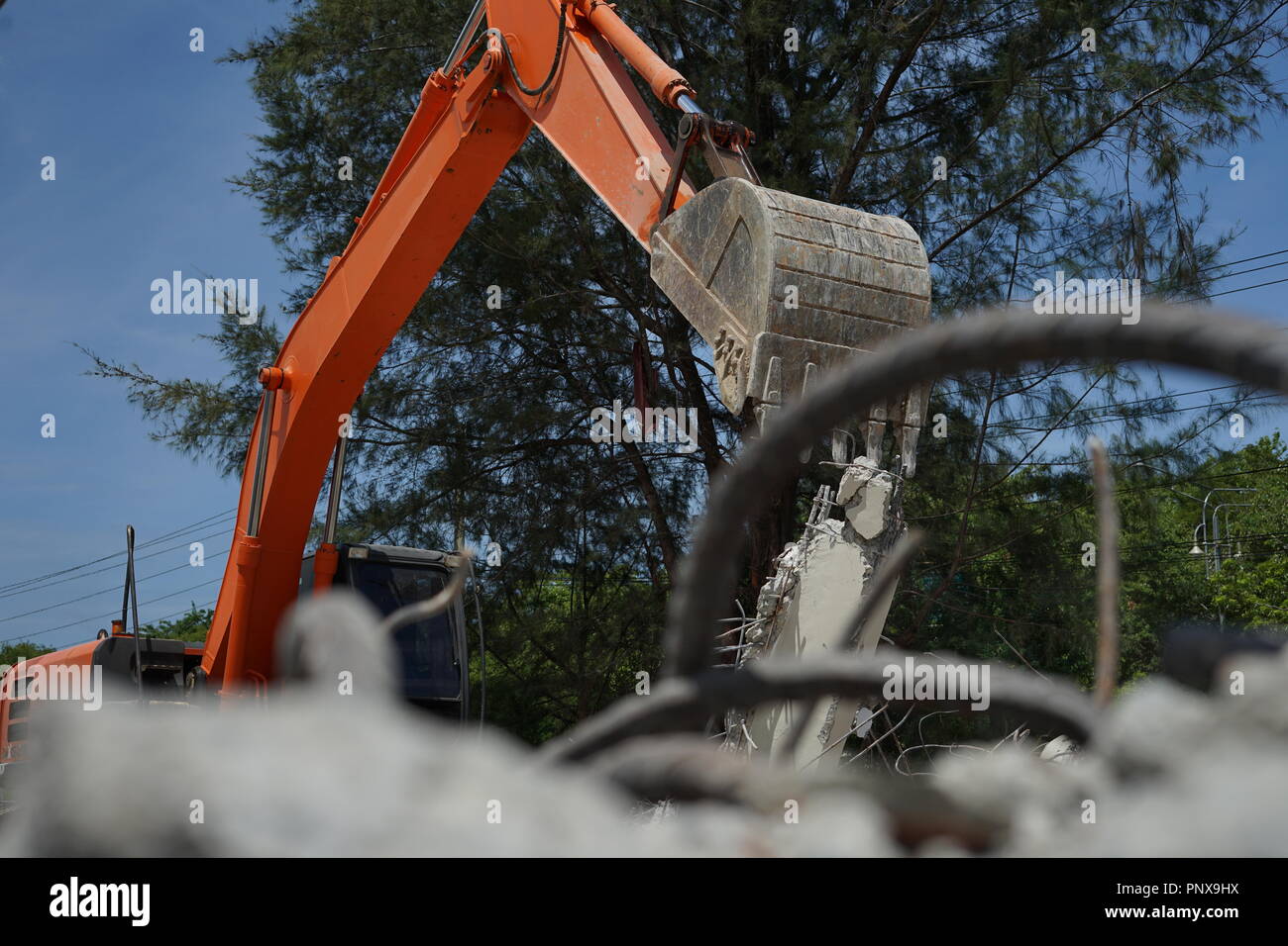 Site/Building demolition using Excavator Stock Photo - Alamy
