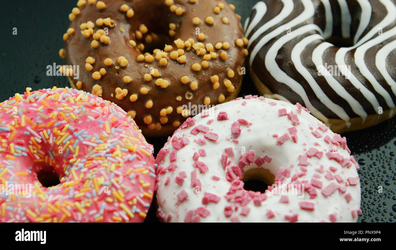 Glazed sweet doughnuts in closeup Stock Photo - Alamy