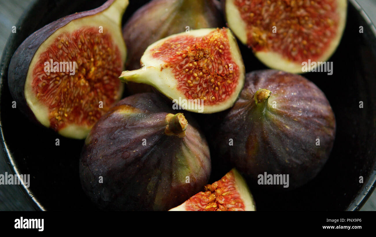Figs in red bowl hi-res stock photography and images - Alamy