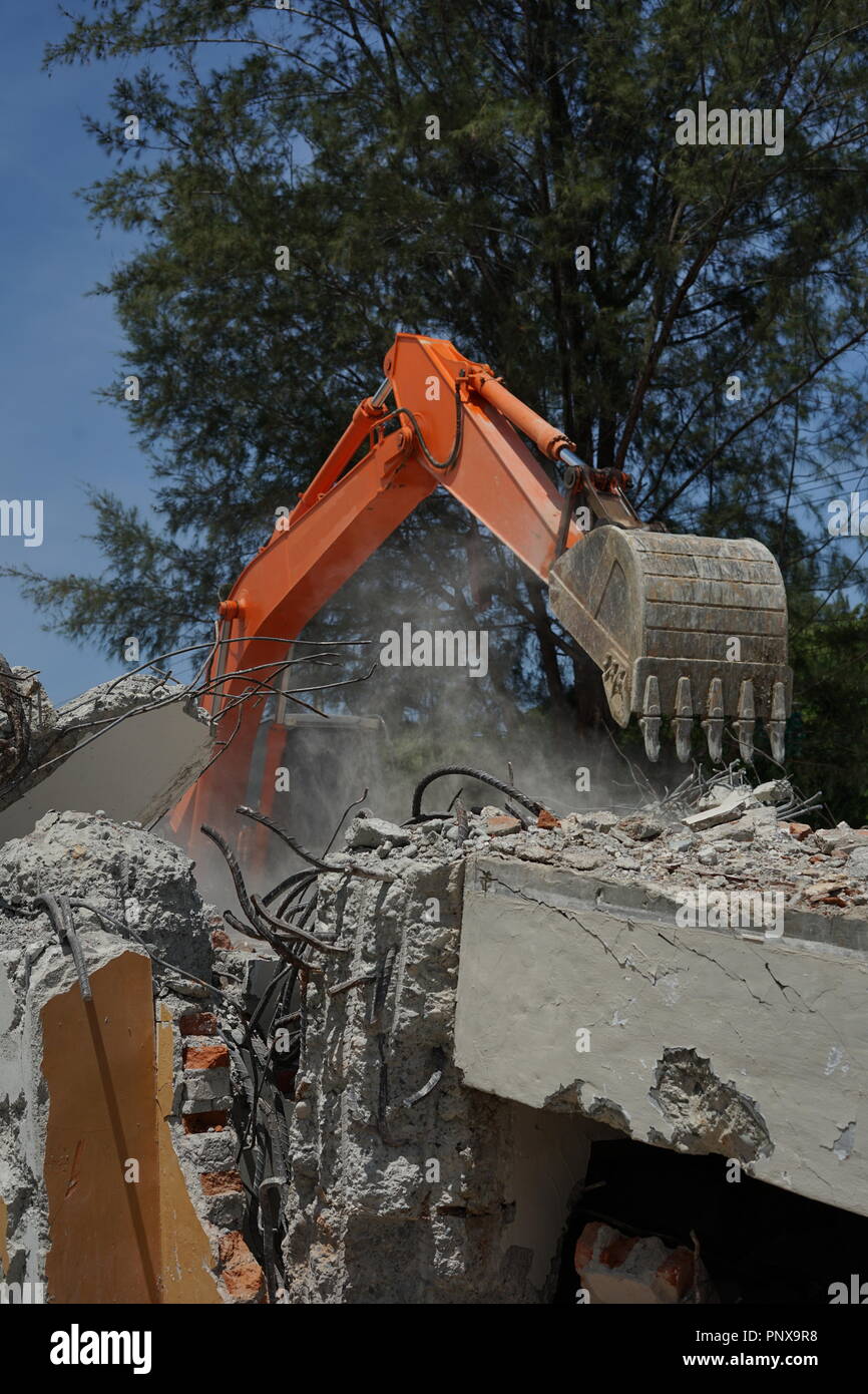 Site/Building demolition using Excavator Stock Photo - Alamy