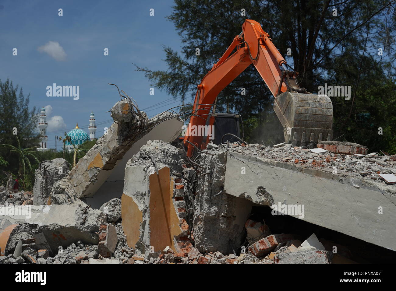 Site/Building demolition using Excavator Stock Photo - Alamy