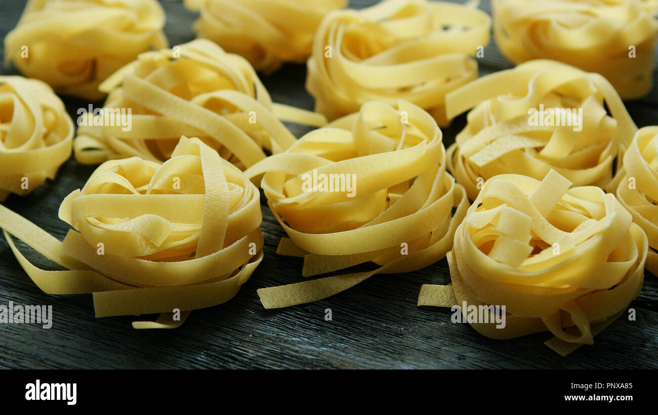 Rolls of uncooked spaghetti Stock Photo - Alamy