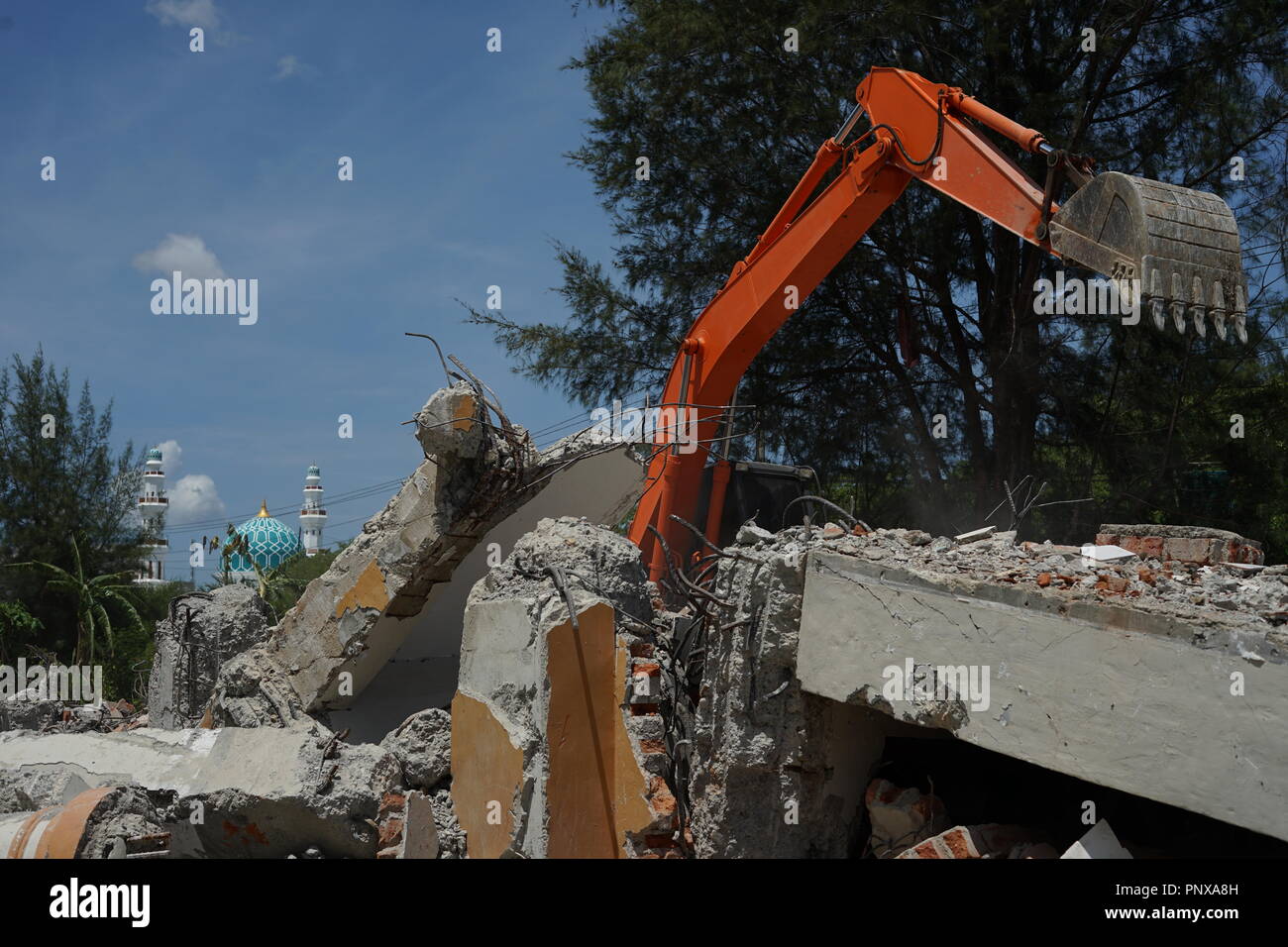 Site/Building demolition using Excavator Stock Photo - Alamy