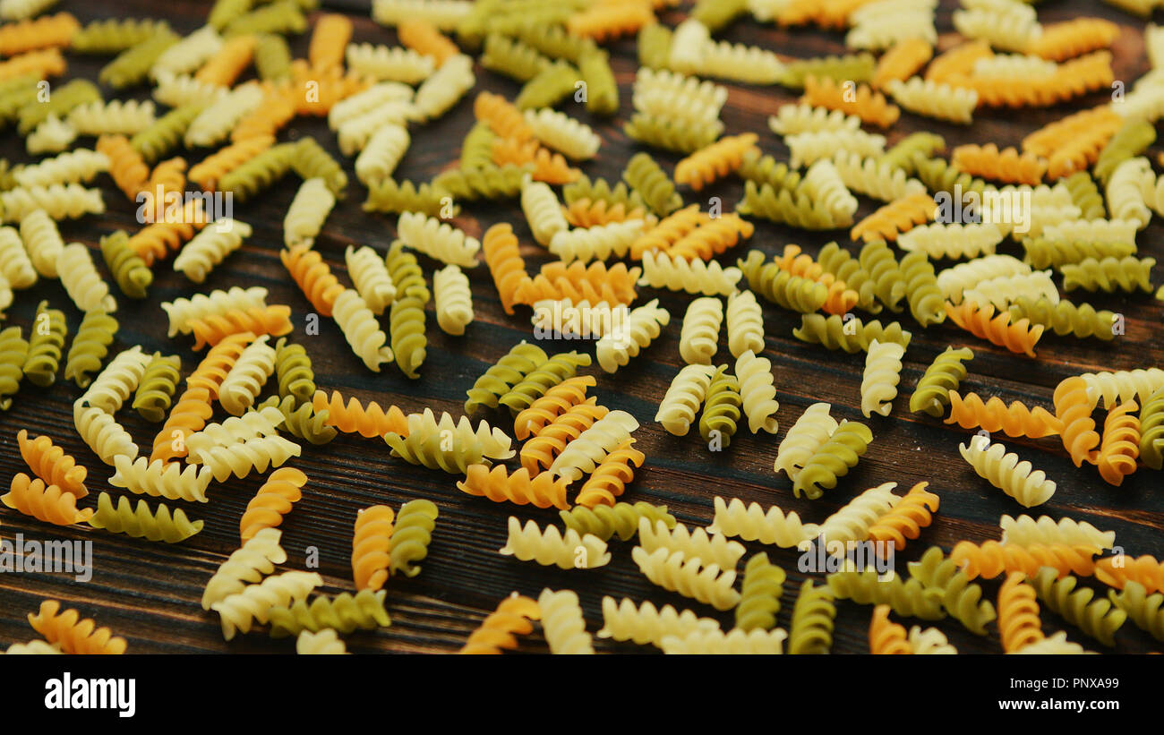 Spiral macaroni of different color Stock Photo - Alamy