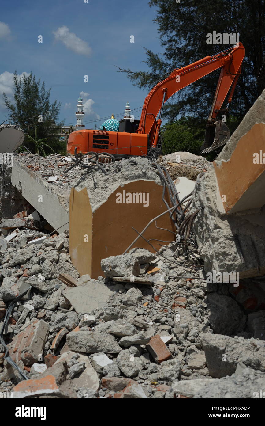 Site/Building demolition using Excavator Stock Photo - Alamy