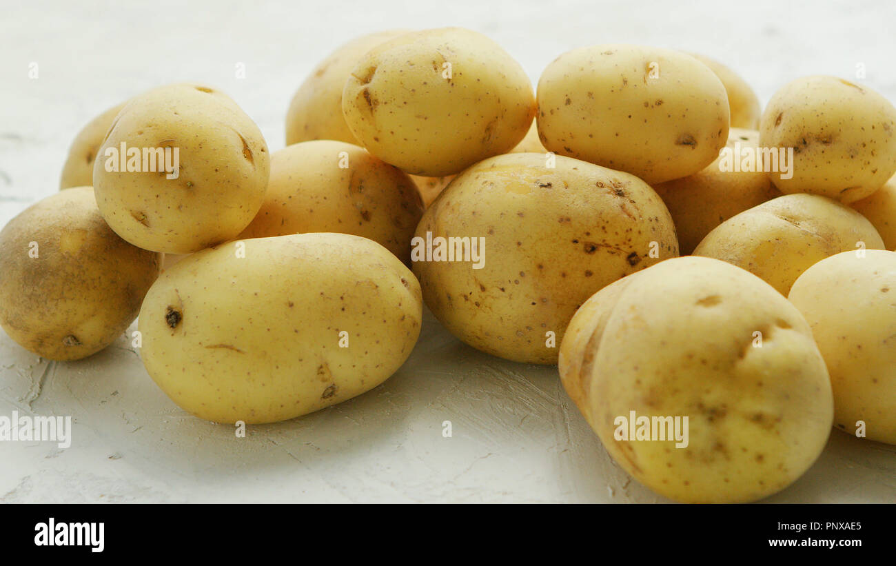Unpeeled clean potatoes in closeup Stock Photo - Alamy