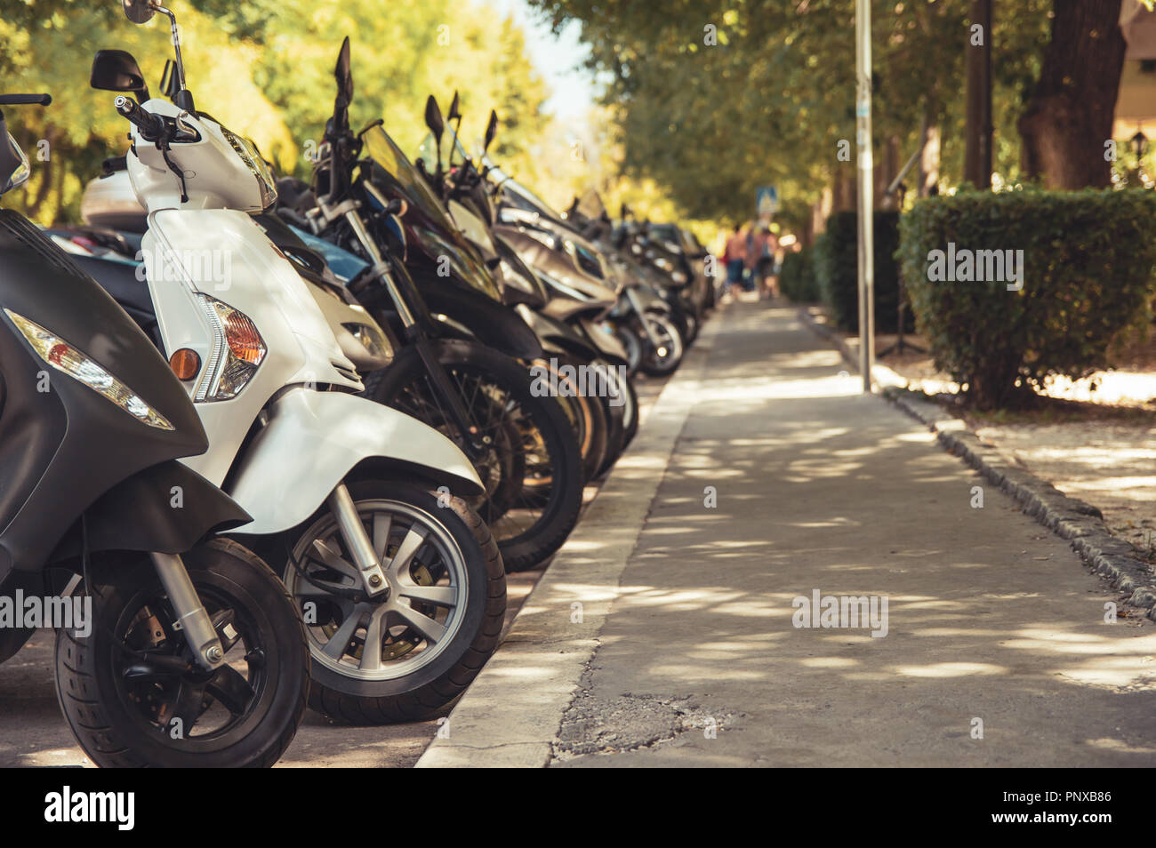 Row of scooters hi-res stock photography and images - Alamy