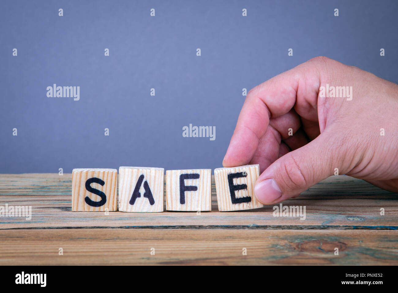 safe. Wooden letters on the office desk Stock Photo - Alamy