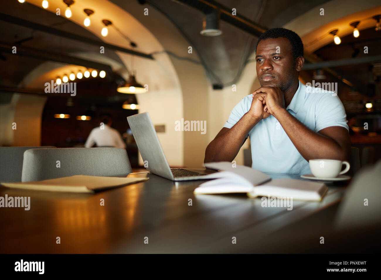 Young businessman concentrating on new ideas for project or solving ...