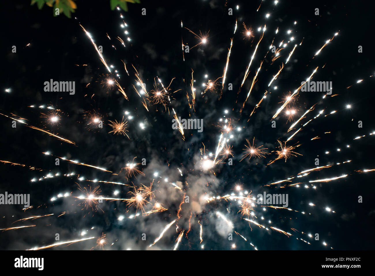 exploding fireworks in night sky Stock Photo - Alamy