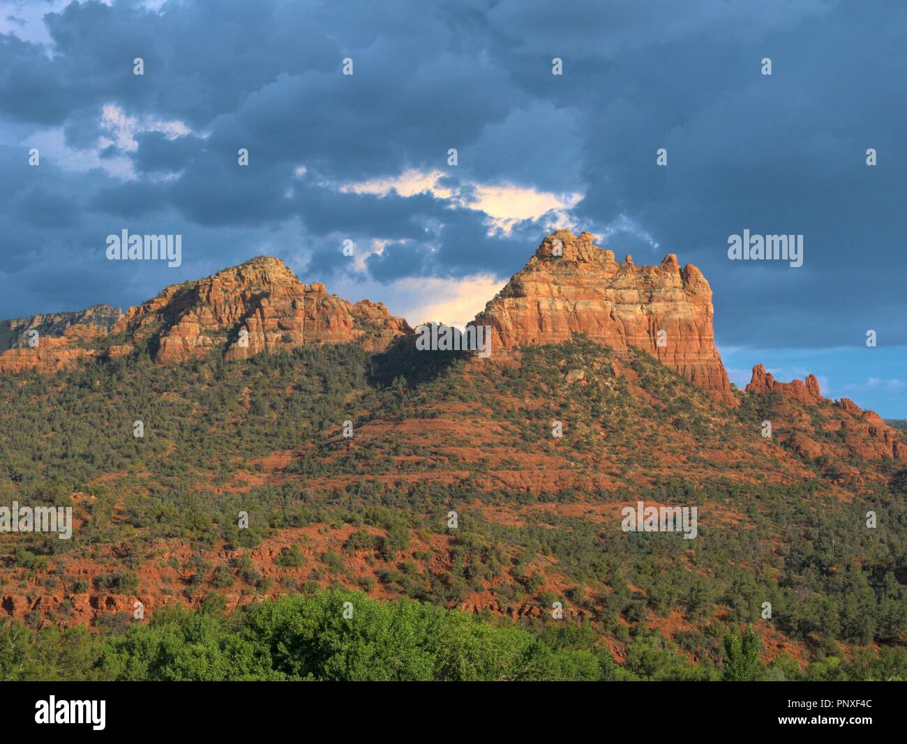 Beautiful red rock mountains in Sedona, Arizona against a dark blue sky ...
