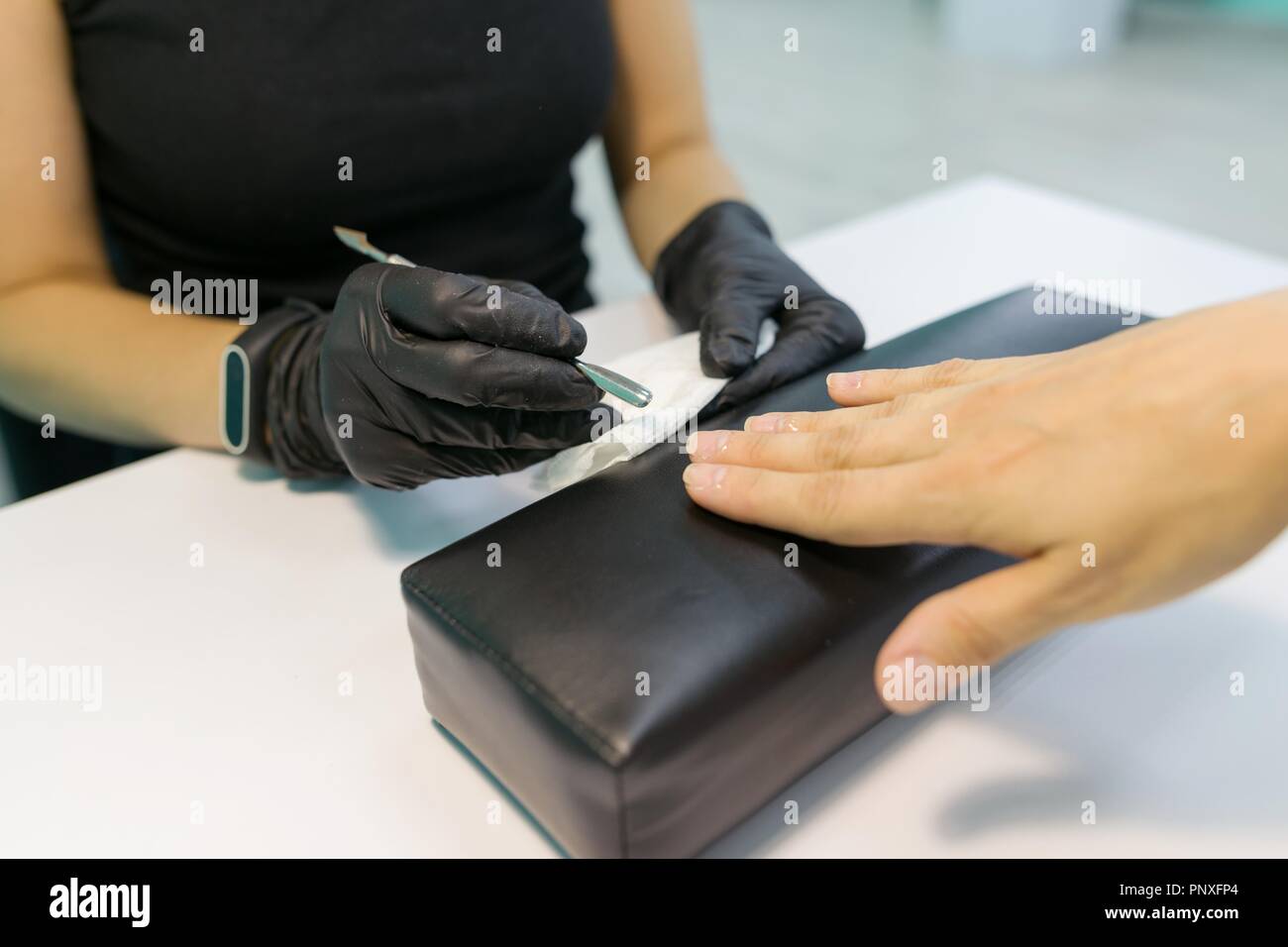 Close-up process of professional manicure, hands of manicurist and ...