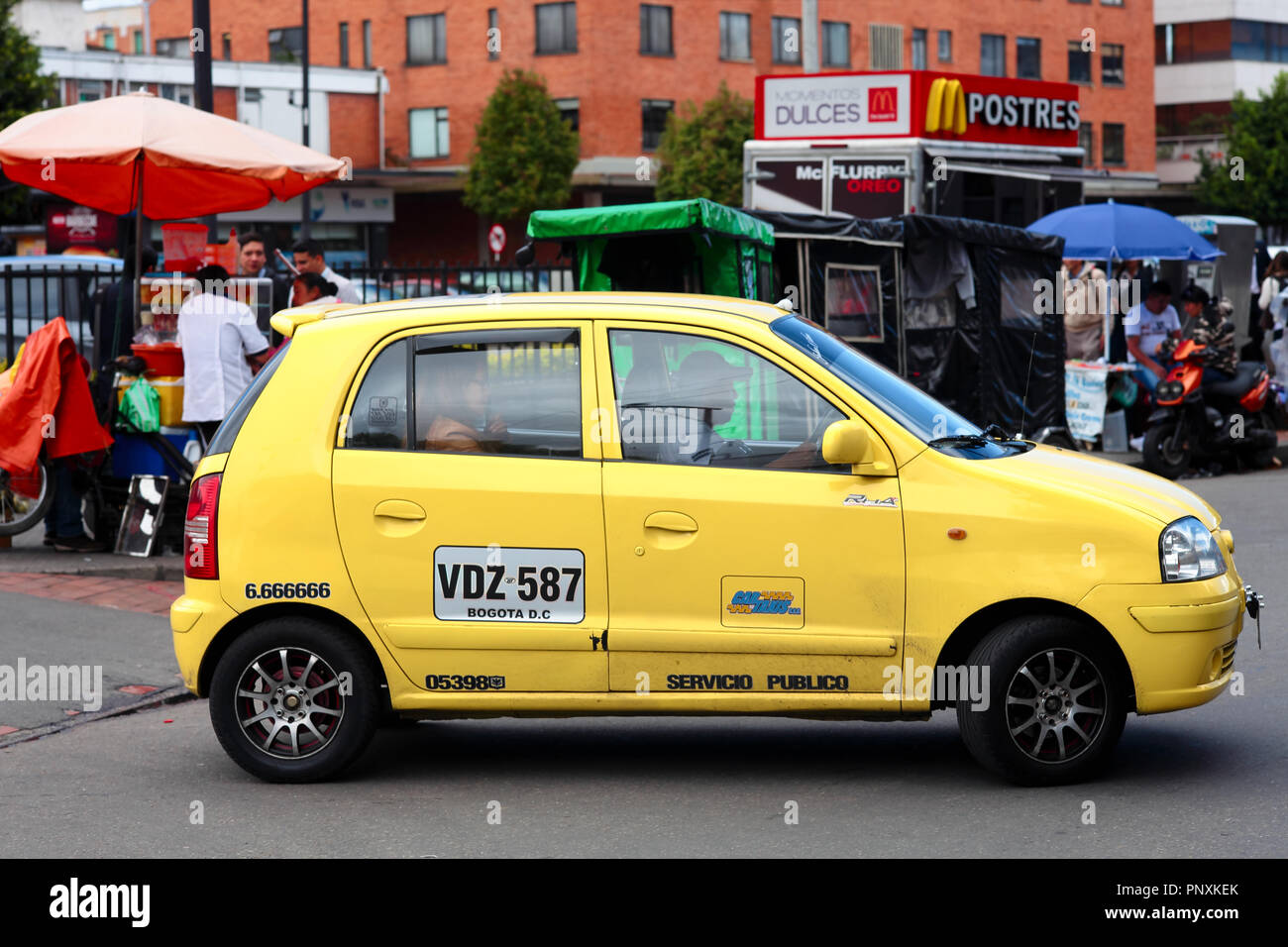 Bogota, Colombia - May 17, 2017: A local Bogota, yellow taxi has just ...