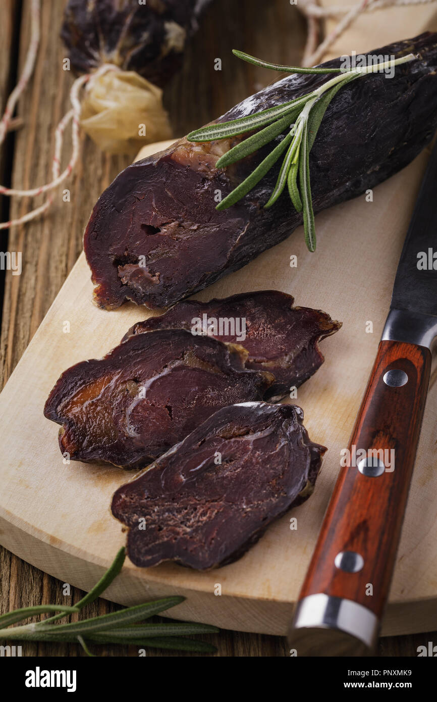 Cut home-cooked smoked sausage on a cutting board, close-up Stock Photo ...