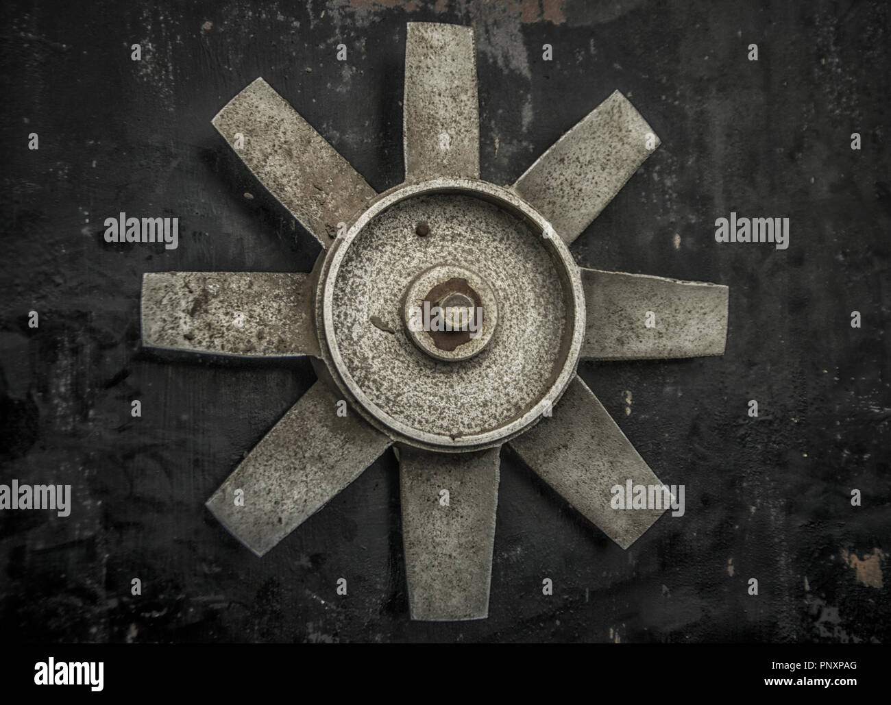 An industrial cog wheel on a black background Stock Photo - Alamy