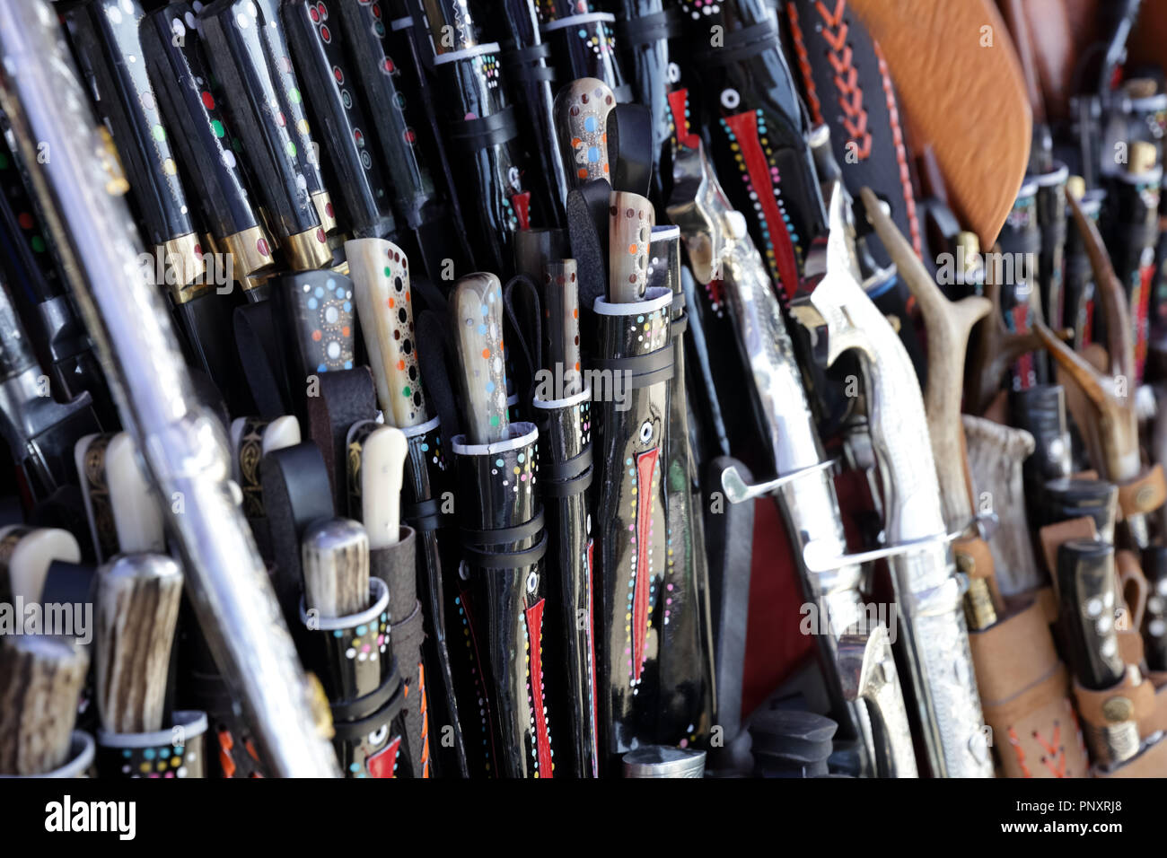 Close-up of traditional knives, daggers and swords used by Uzbeks of ...