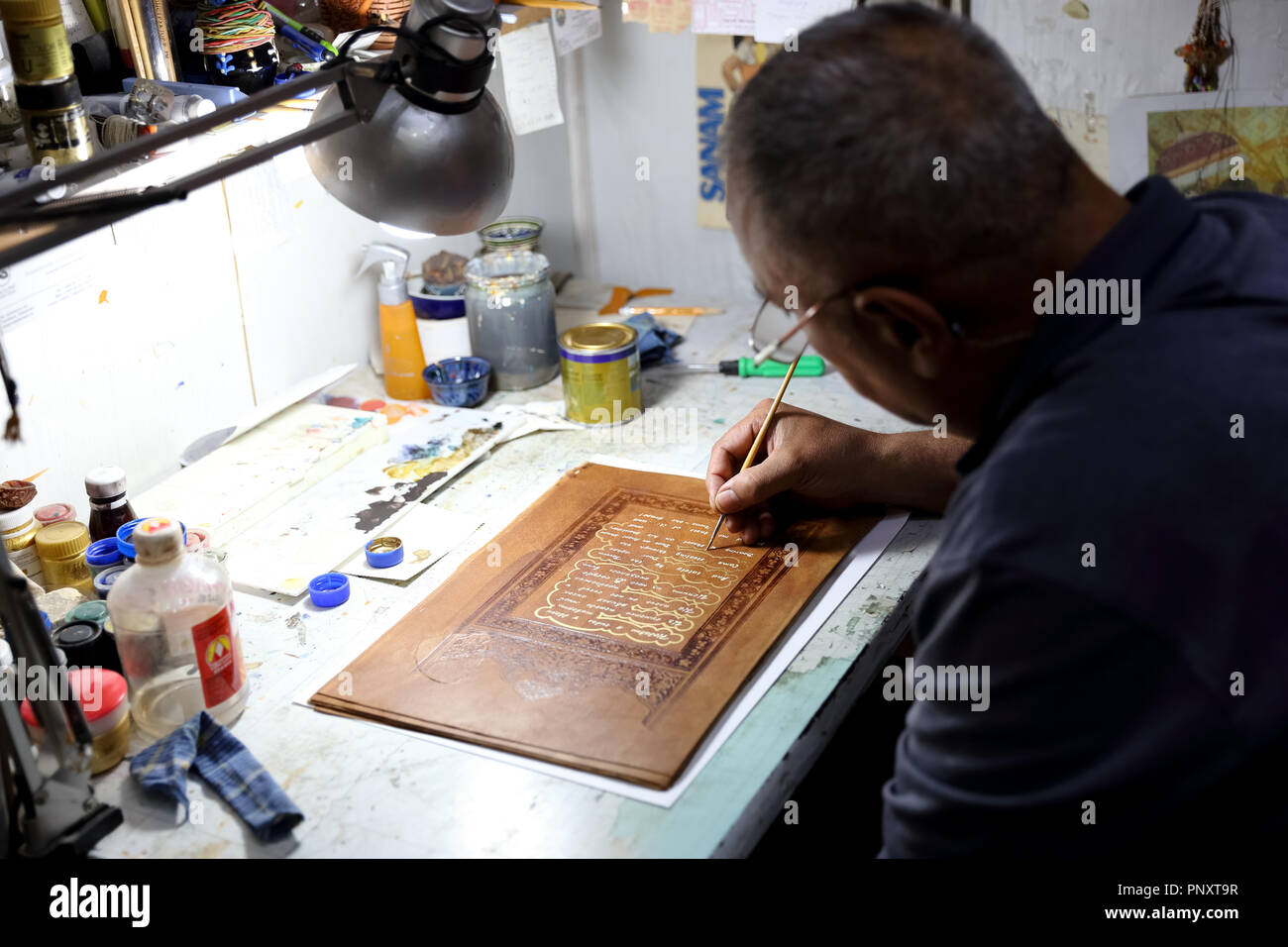 Tashkent, Uzbekistan - May 02, 2017: Unknown Uzbek artist painting on a ...