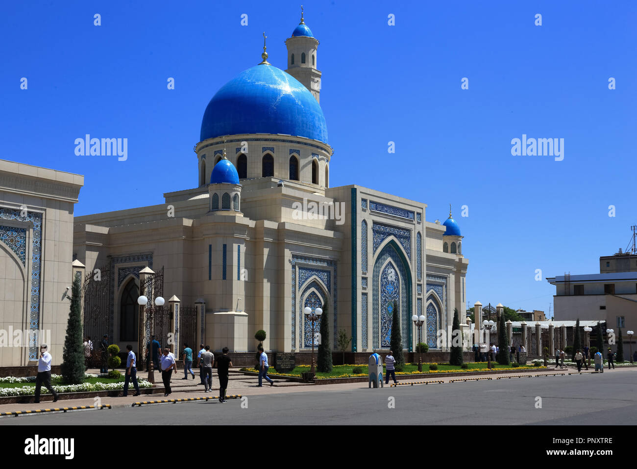 Tashkent, Uzbekistan - May 12, 2017: Uzbek people entering the mosque ...
