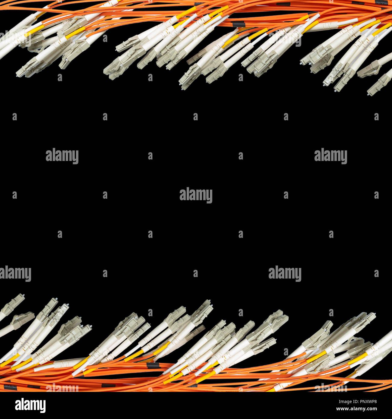 Bunch of fiber optic cables and connectors on black background with ...
