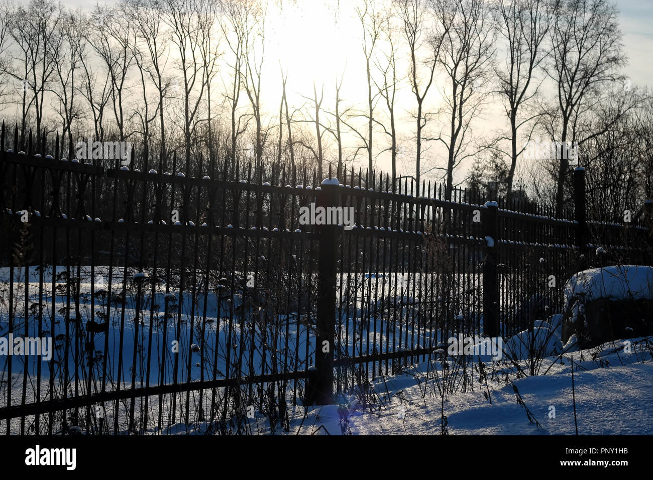 fence with spikes sun Stock Photo - Alamy