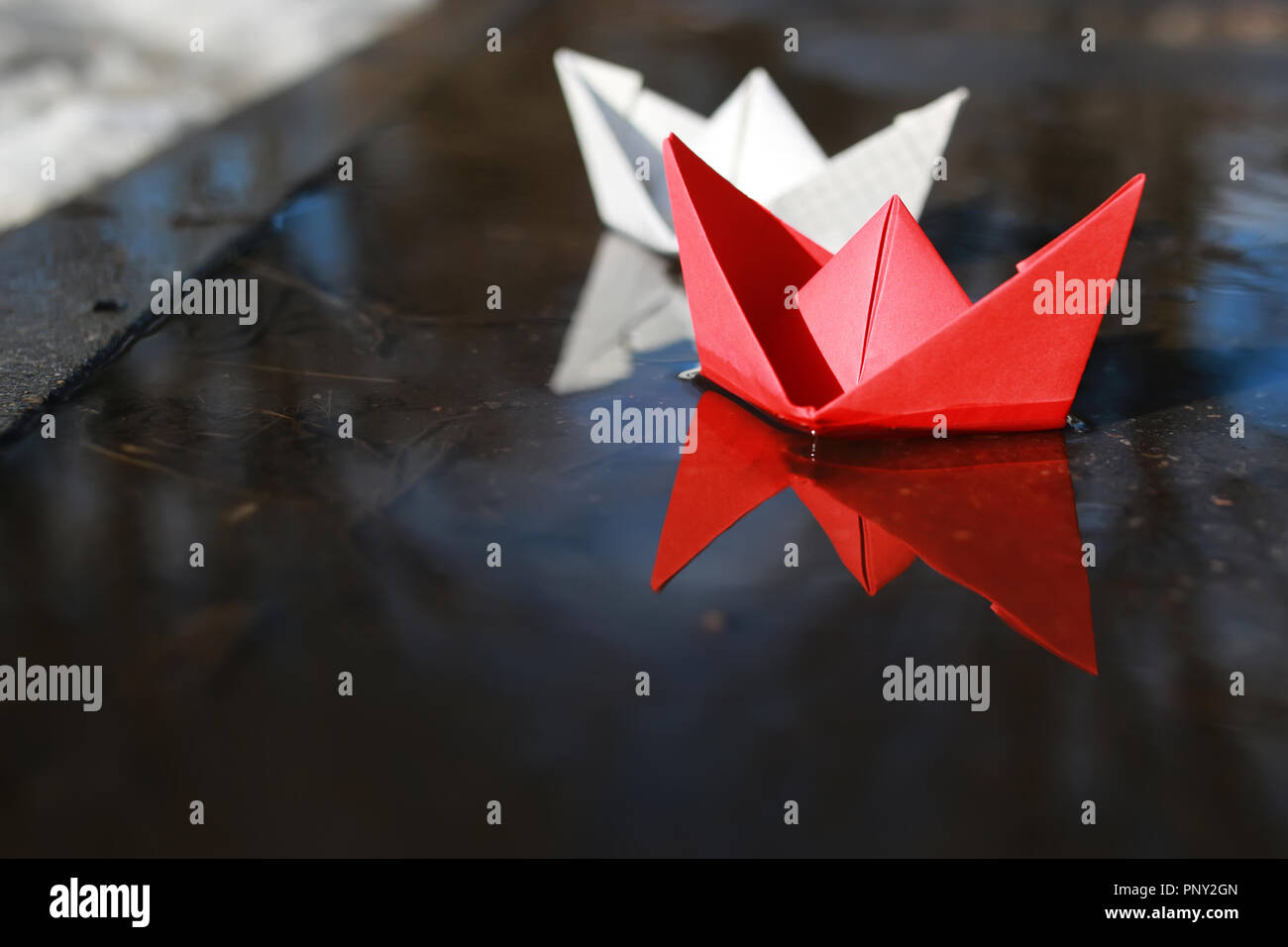 paper boat in a pool Stock Photo - Alamy