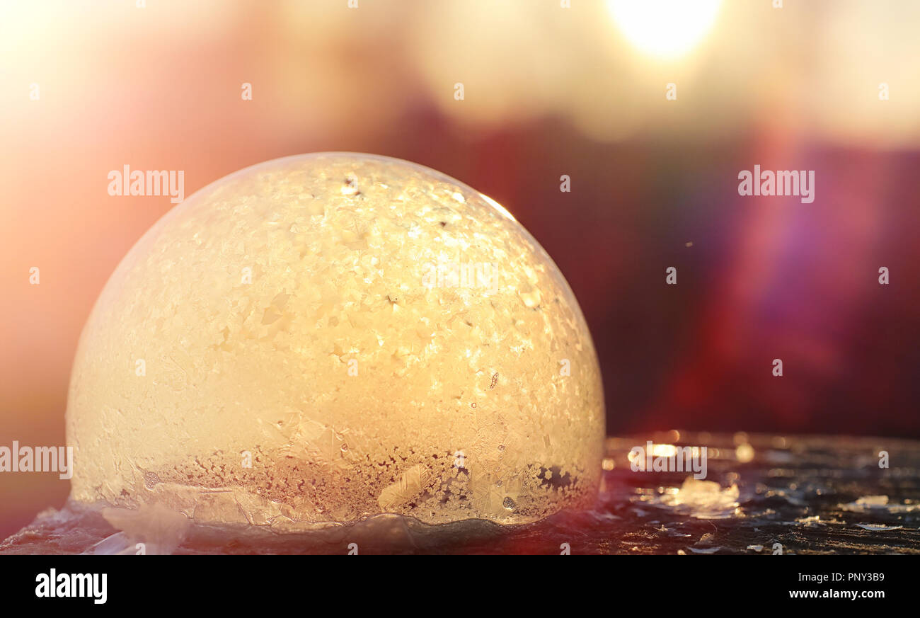 Soap bubbles freeze in the cold. Winter soapy water freezes in t Stock ...