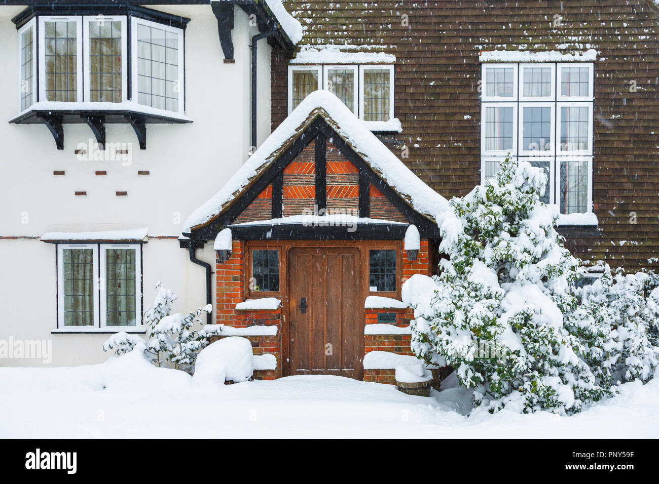 Wooden oak front door and porch of a large house with undisturbed ...