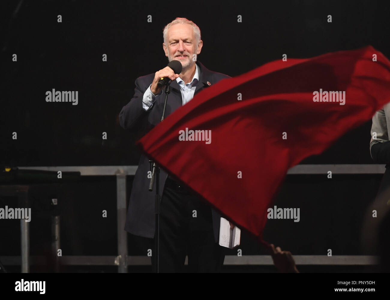 A red flag flies as Labour leader Jeremy Corbyn speaks at a rally at ...